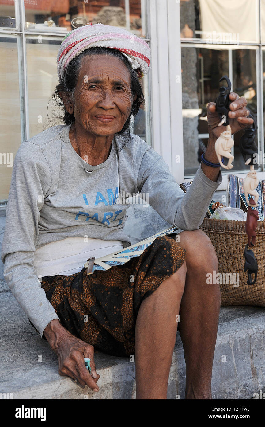 Local woman sell statues of monkeys souvenir in the Monkey forest ...