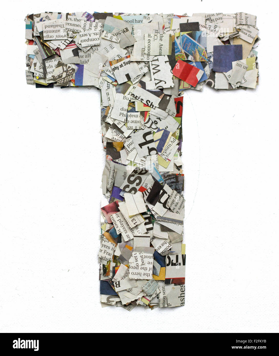 The letter T made from newspaper confetti Stock Photo - Alamy