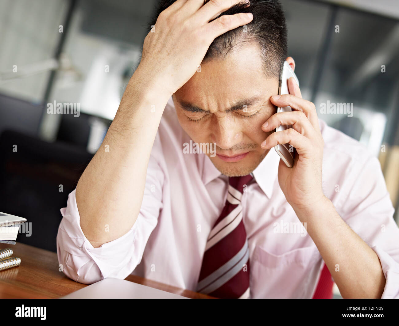 Frustrated Office Worker Phone Stock Photos & Frustrated Office Worker ...