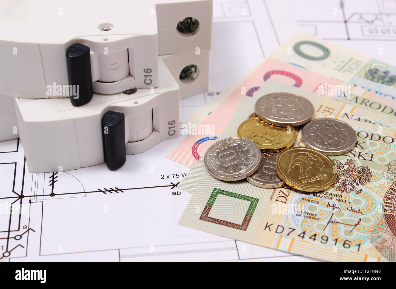 Electric fuse and money on electrical construction drawing of house ...