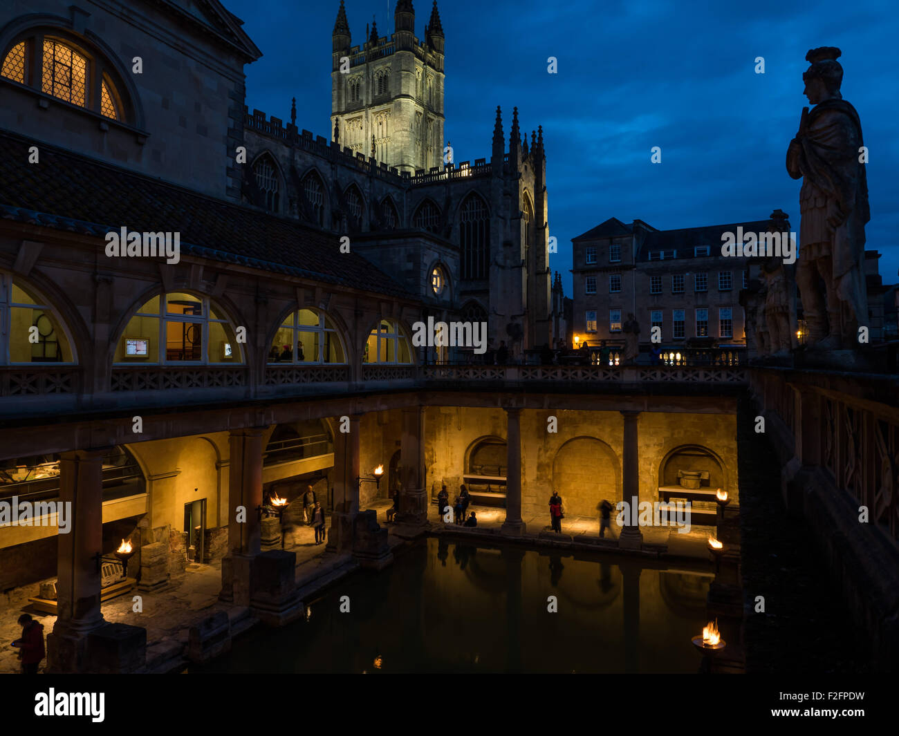An evening picture of the famous Roman bath at Bath in the evening lit ...