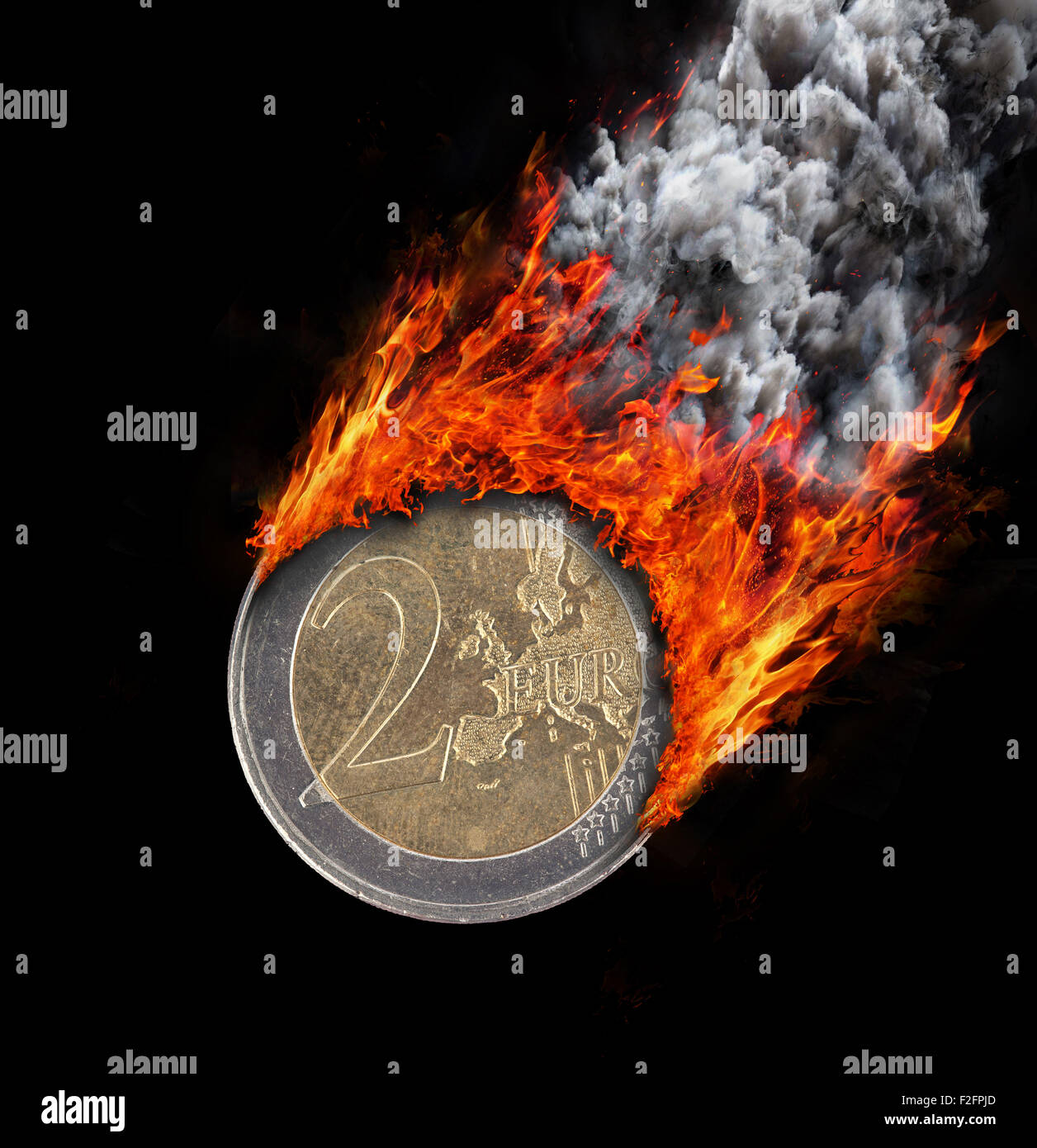Burning coin with a trail of fire and smoke - 2 euro Stock Photo - Alamy