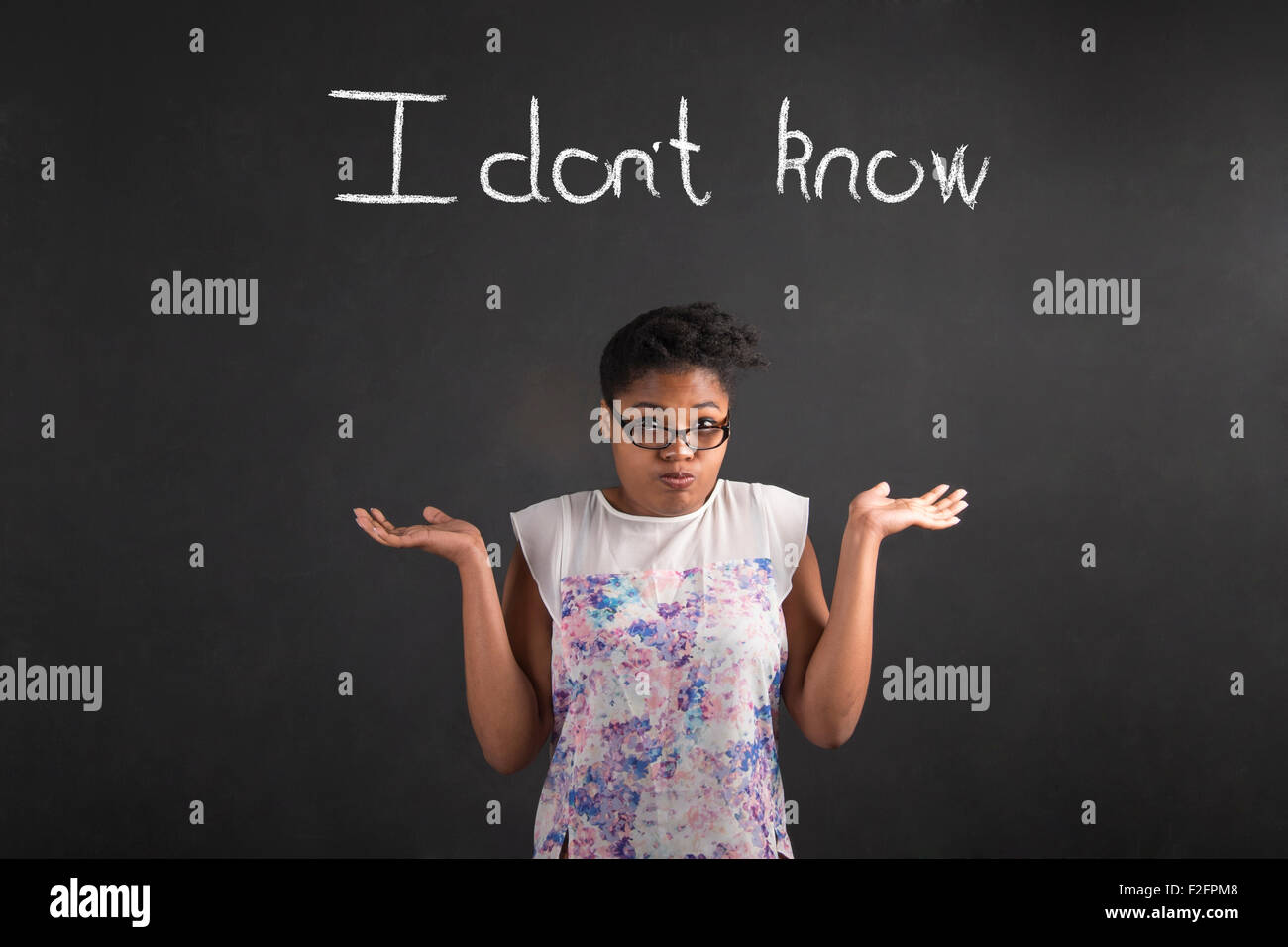 South African or African American black woman teacher or student posing ...
