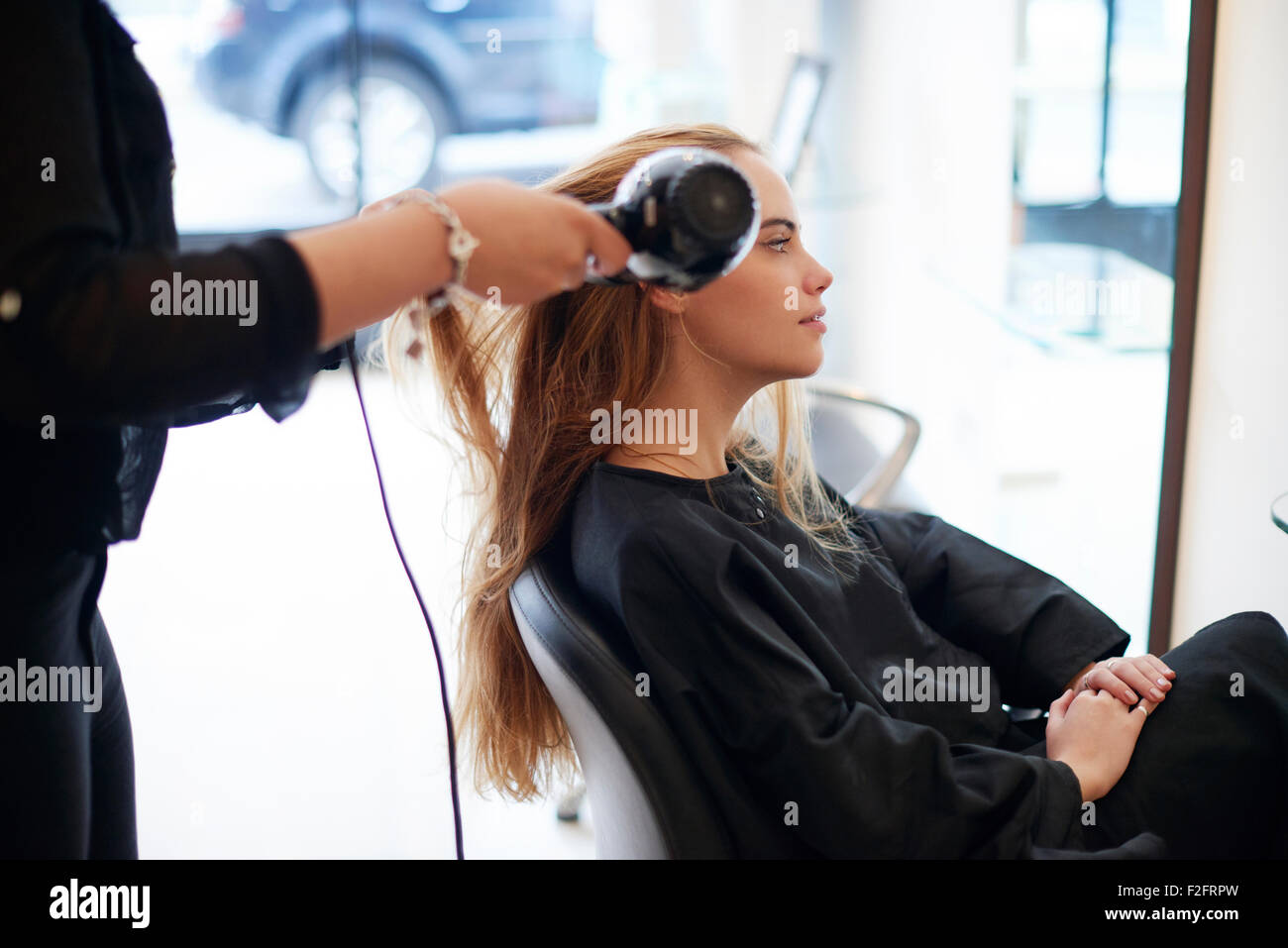 Women drying their hair hi-res stock photography and images - Alamy