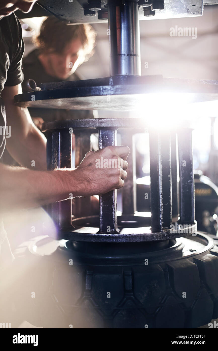 Mechanic using tire machinery hi-res stock photography and images - Alamy