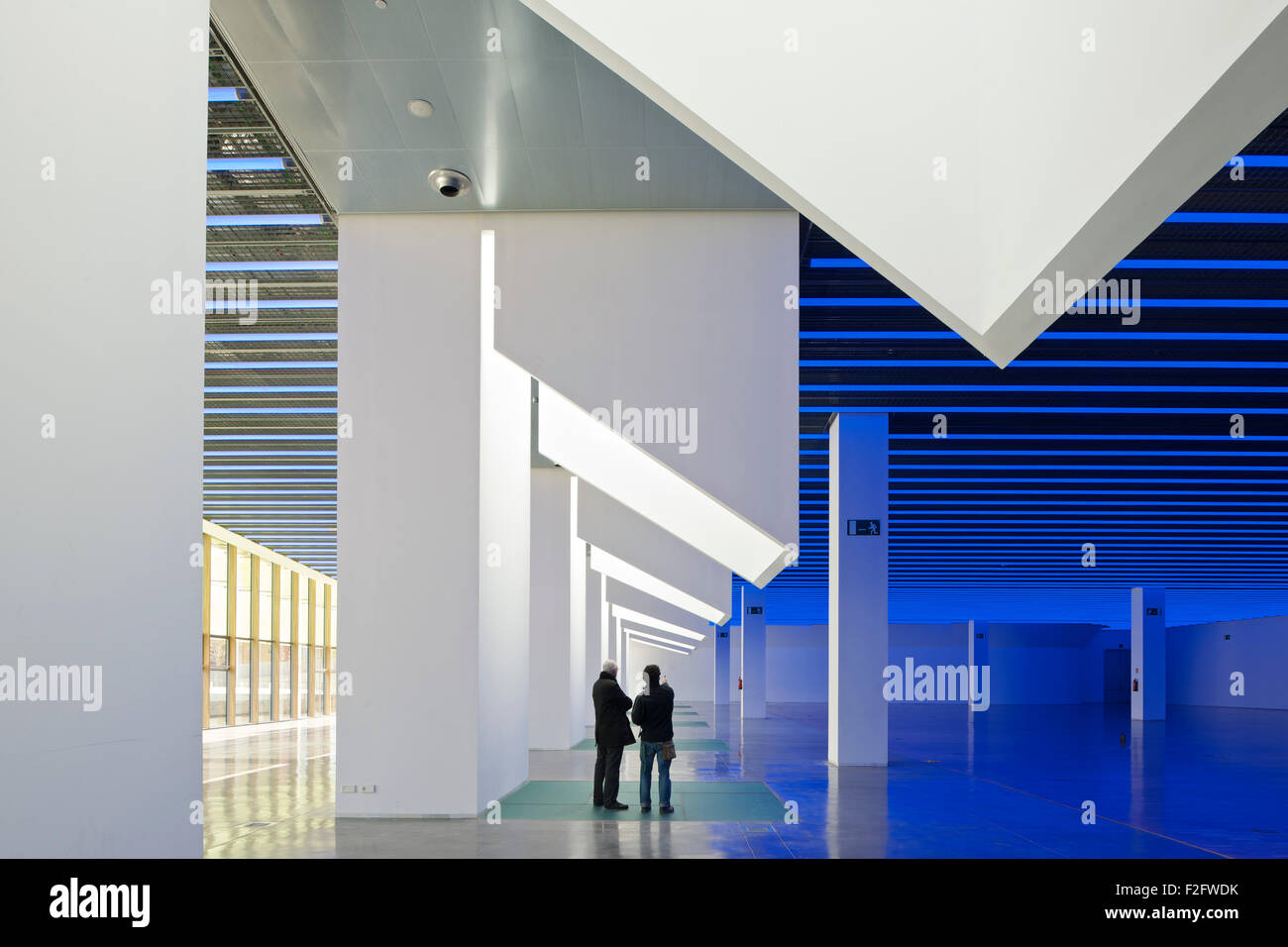Skylight columns and ground floor gallery in blue light with ...