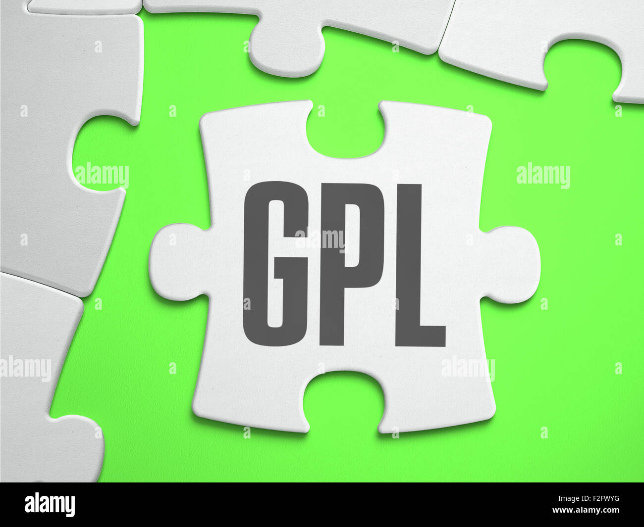 GPL - General Public License - Jigsaw Puzzle with Missing Pieces. Bright Green Background. Close ...