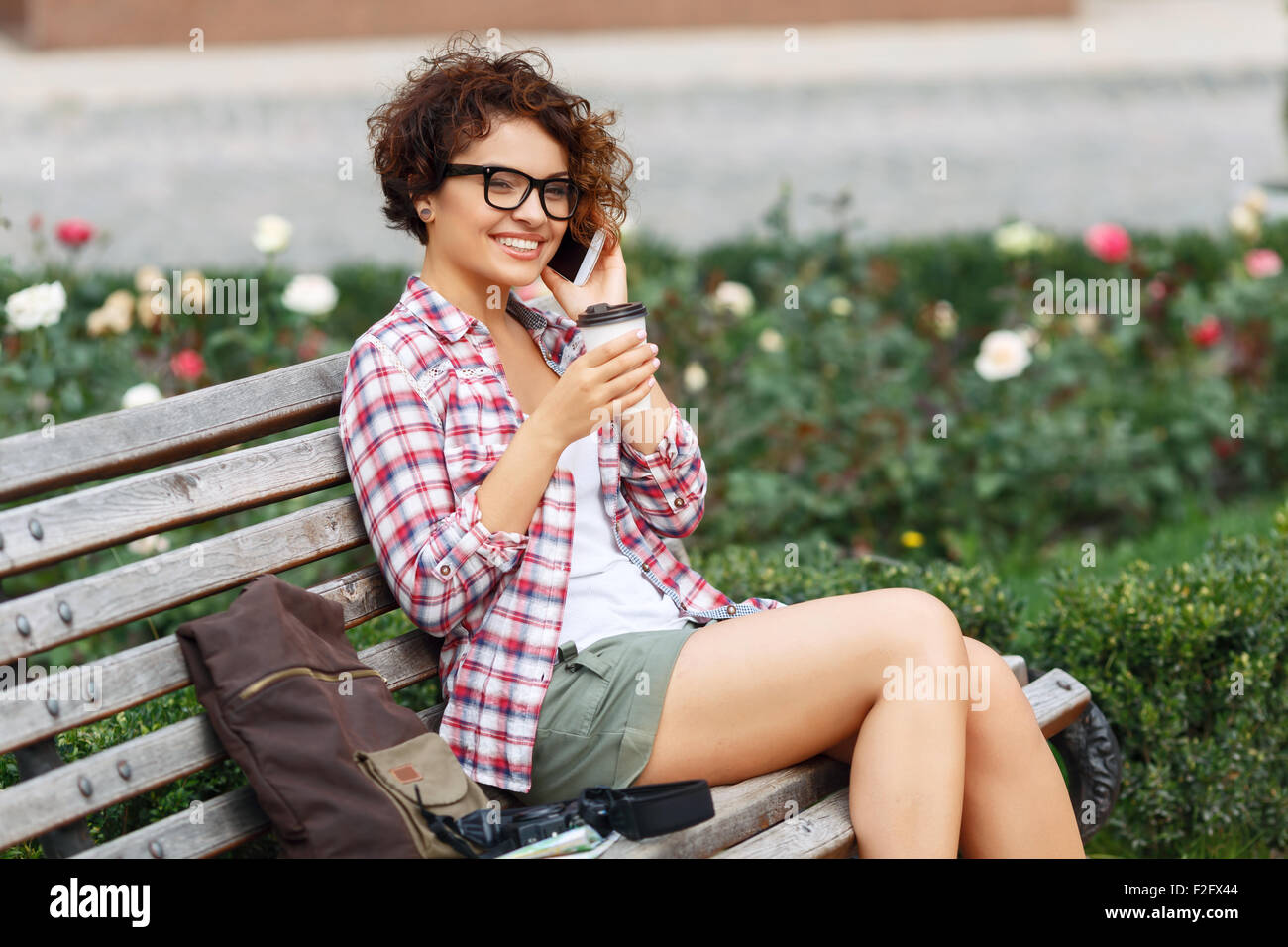 Nice girl sitting on the bench Stock Photo - Alamy