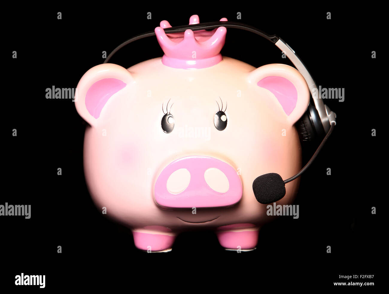 piggy bank wearing headset cutout Stock Photo - Alamy