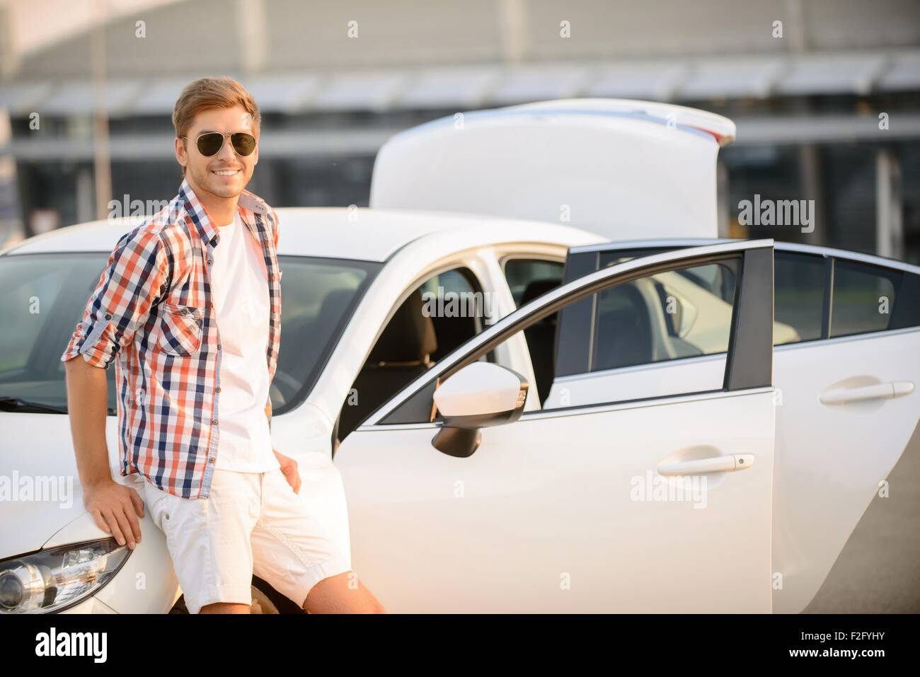Nice man standing near car Stock Photo - Alamy