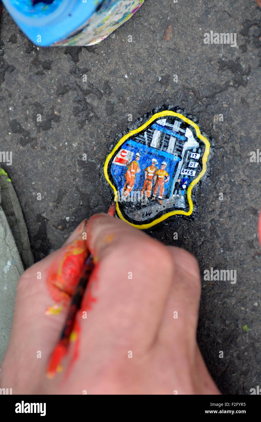 Ben Wilson "Chewing Gum Man" painting a tiny work of art on a discarded ...