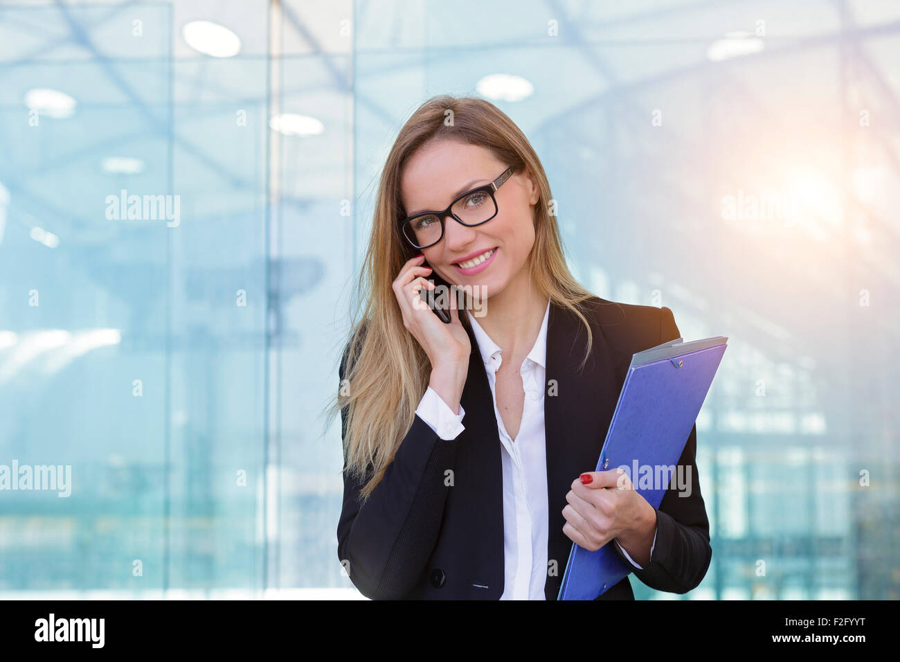 Businesswoman talking on mobile phone Stock Photo - Alamy
