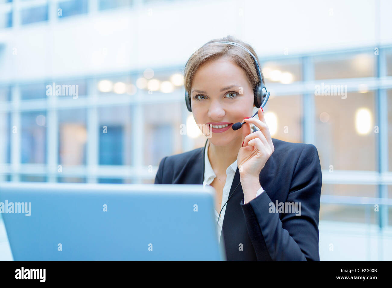 Female hotline operator talking hi-res stock photography and images - Alamy