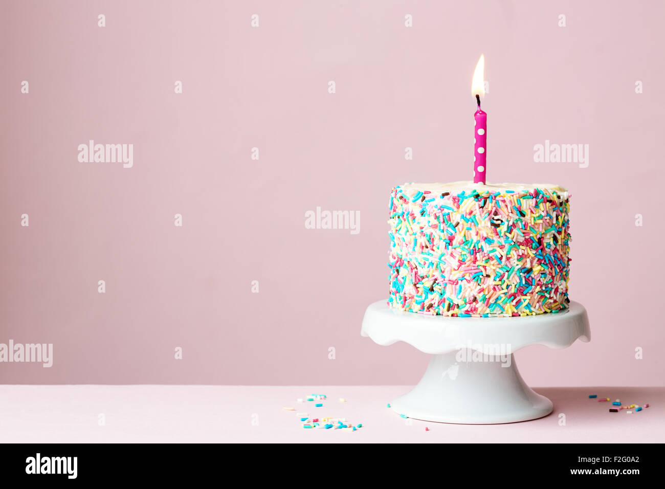 Birthday cake with one candle Stock Photo - Alamy