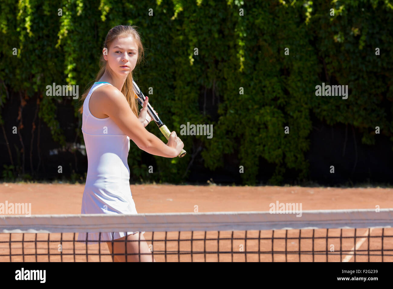 Young tennis athlete ready to return a ball Stock Photo - Alamy