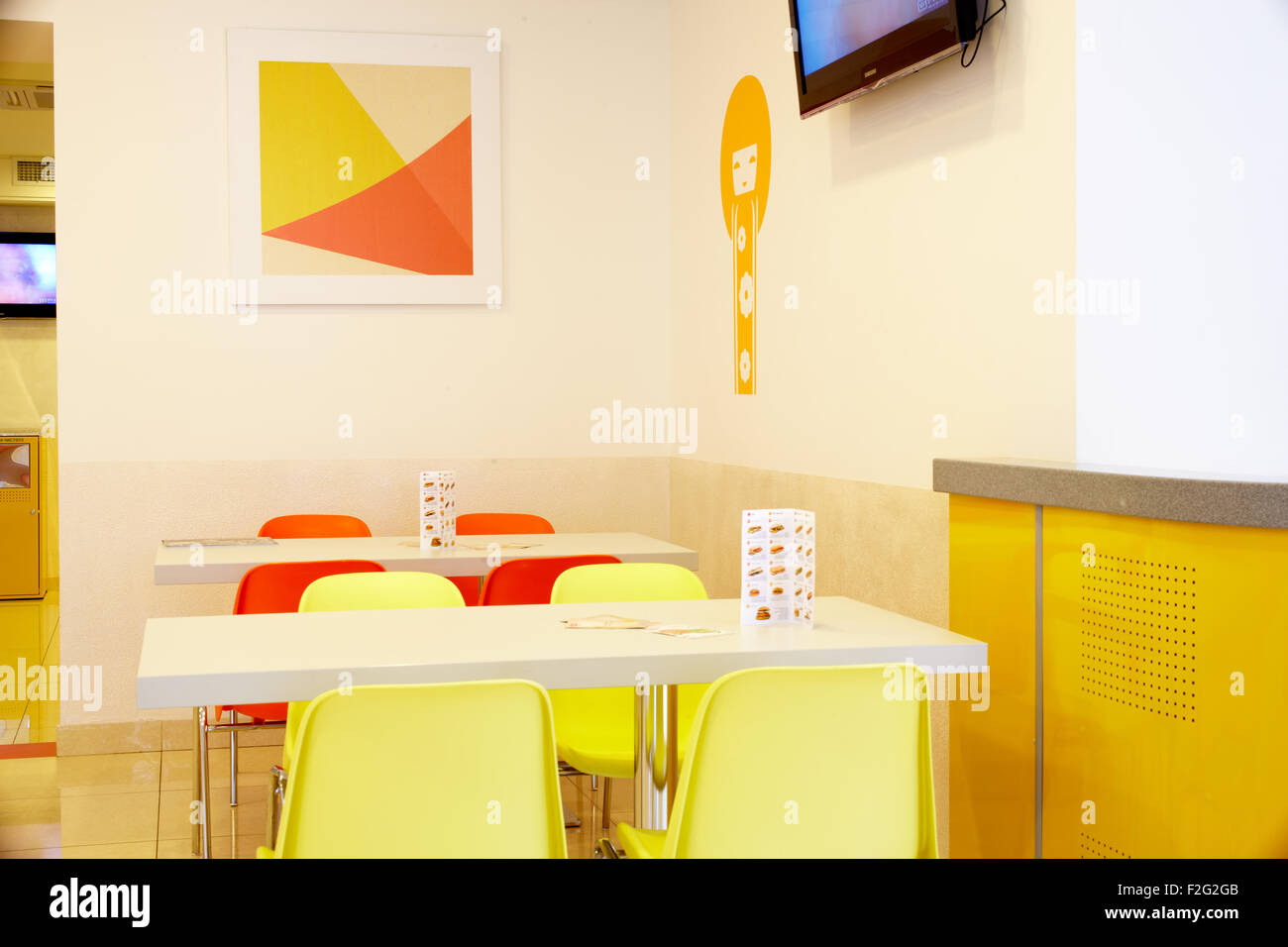 Interior of a yellow fast food restaurant Stock Photo - Alamy