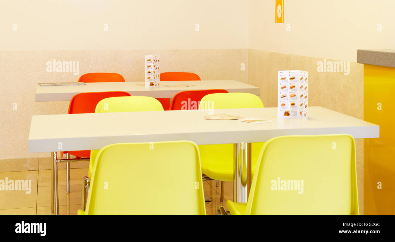 Interior of a yellow fast food restaurant Stock Photo - Alamy