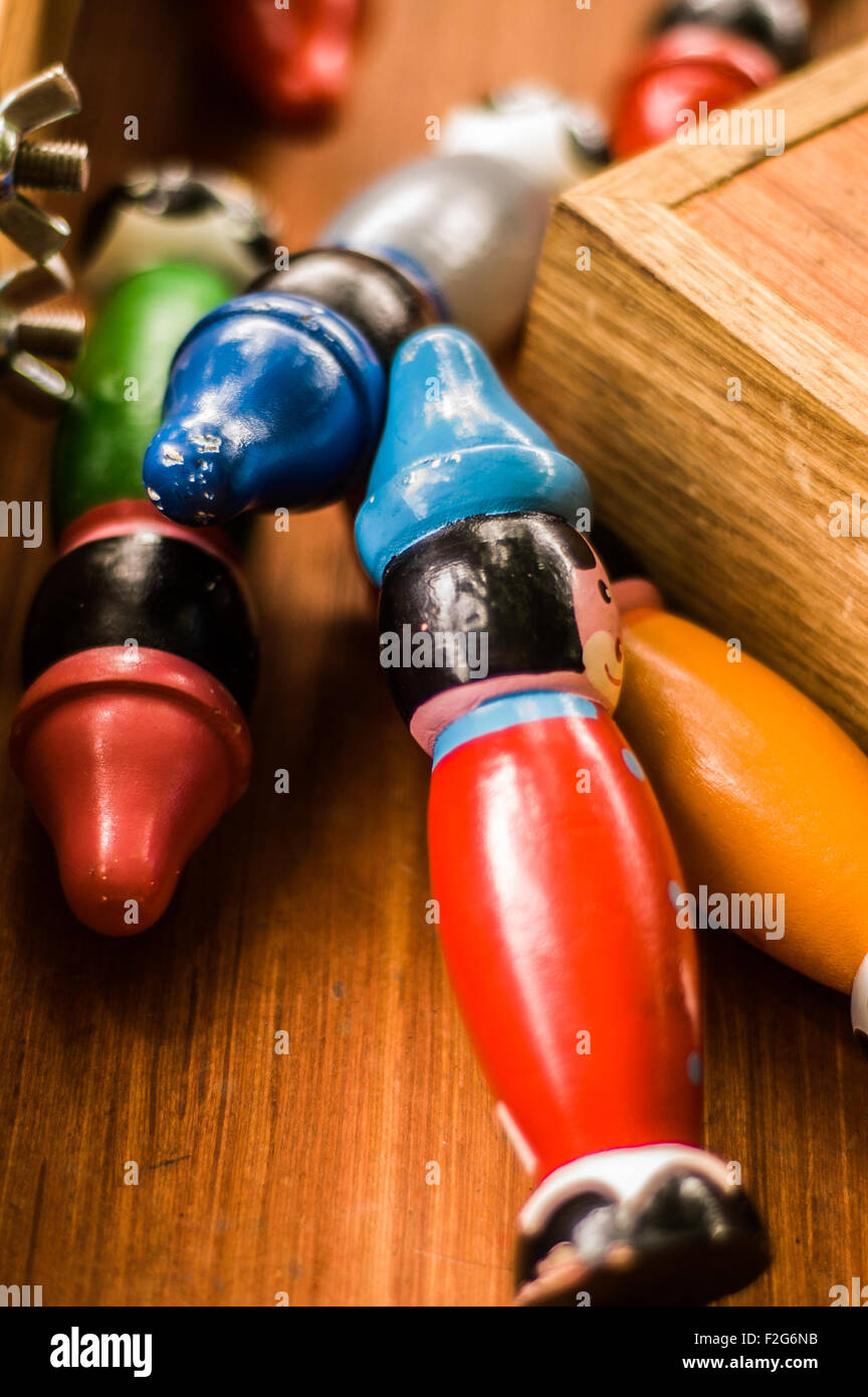 Kids skittle toy figures knocked over Stock Photo - Alamy