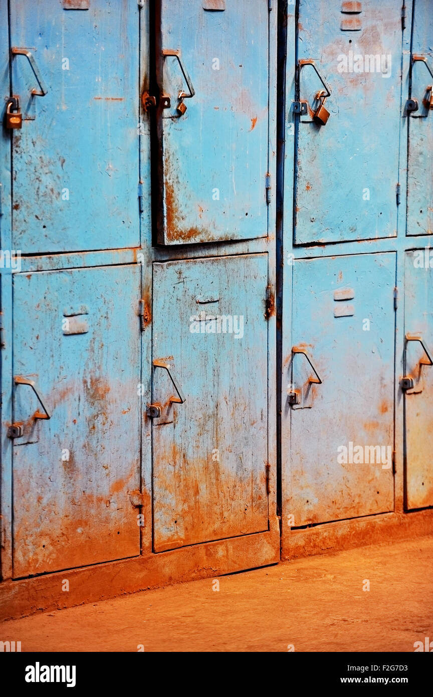 Old and rusty blue lockers abandoned inside industrial building Stock ...