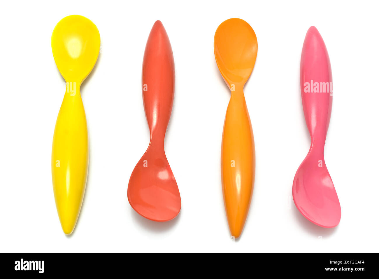 Colorful spoons isolated on white Stock Photo - Alamy