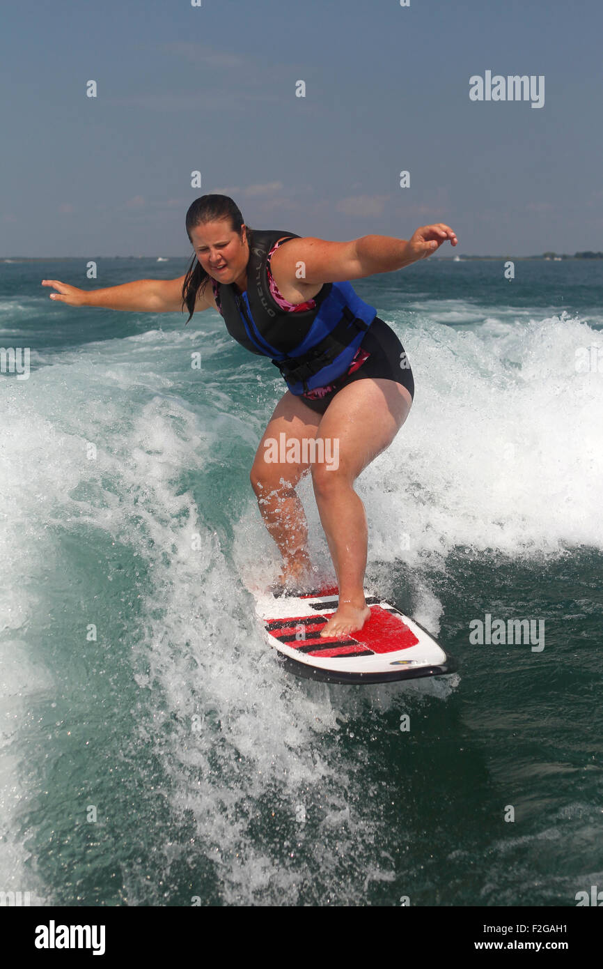 Riding a surfboard hi-res stock photography and images - Alamy