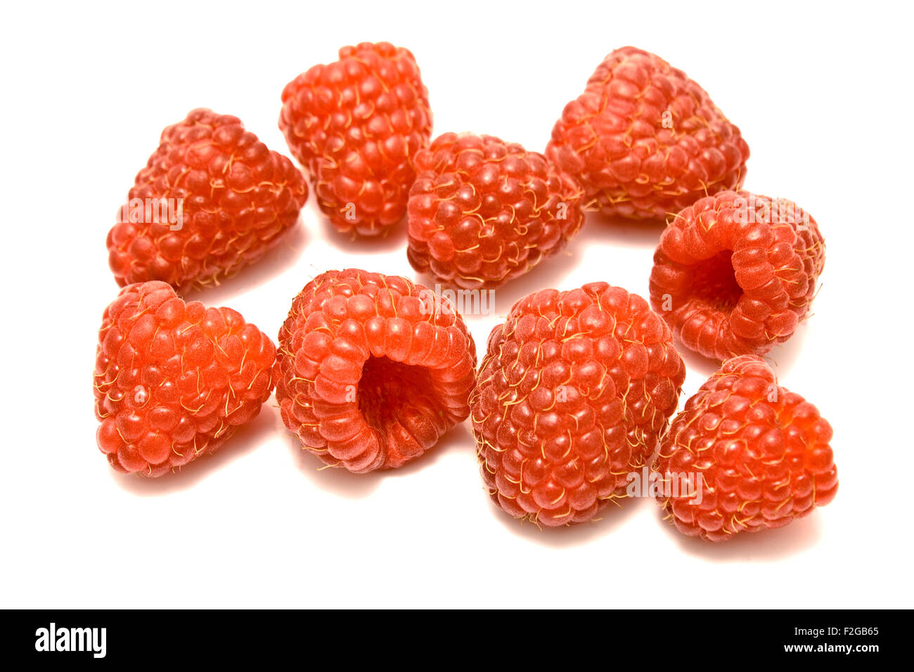 Red raspberries isolated on white Stock Photo - Alamy
