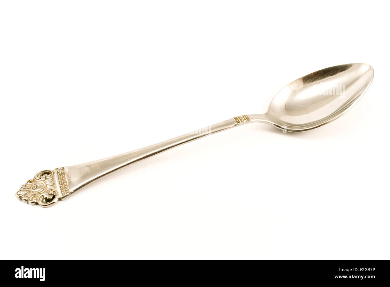 Metal spoon isolated on white Stock Photo - Alamy