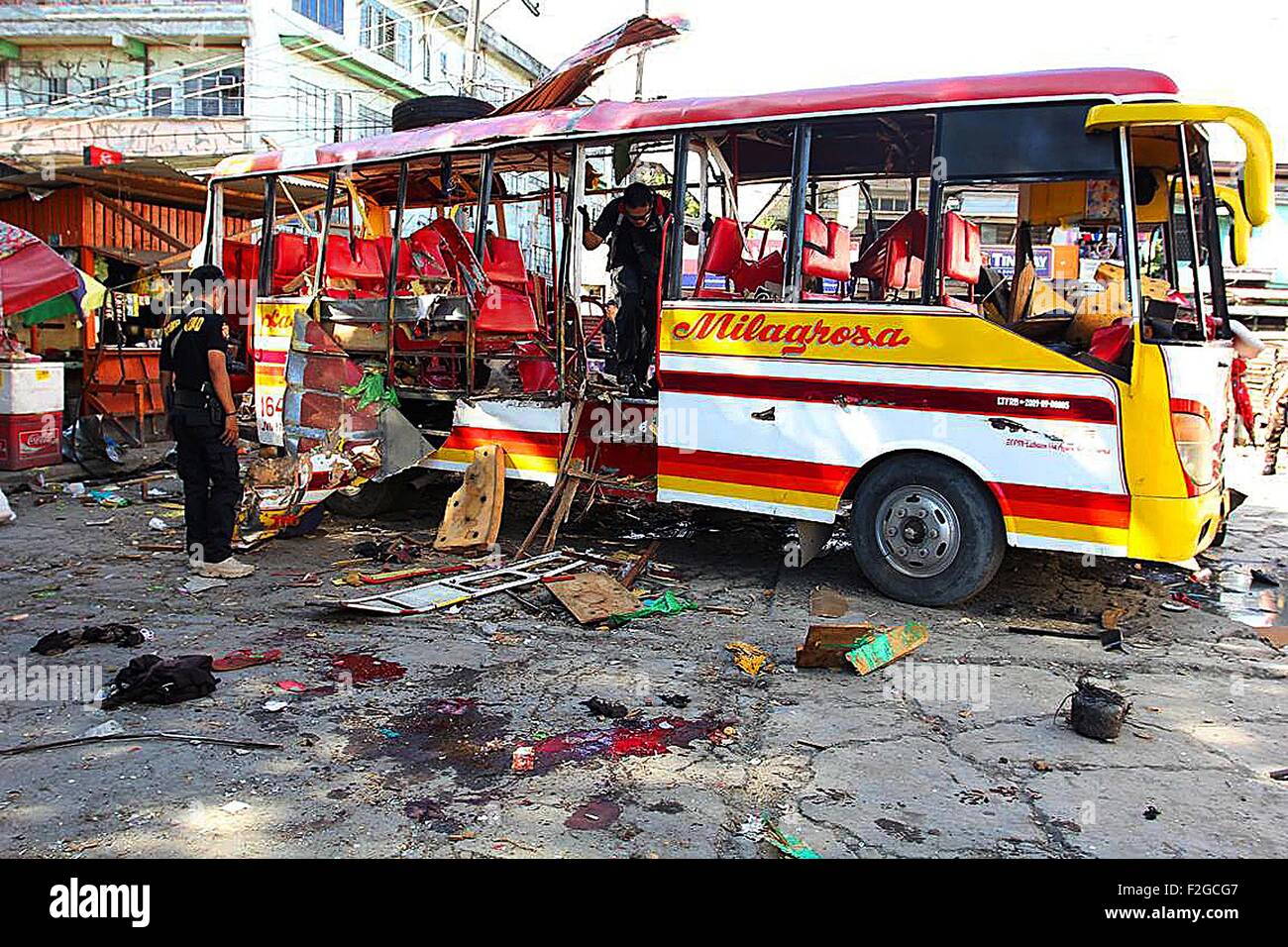 Zamboanga City. 18th Sep, 2015. Police inspect the wreckage of a bus ...