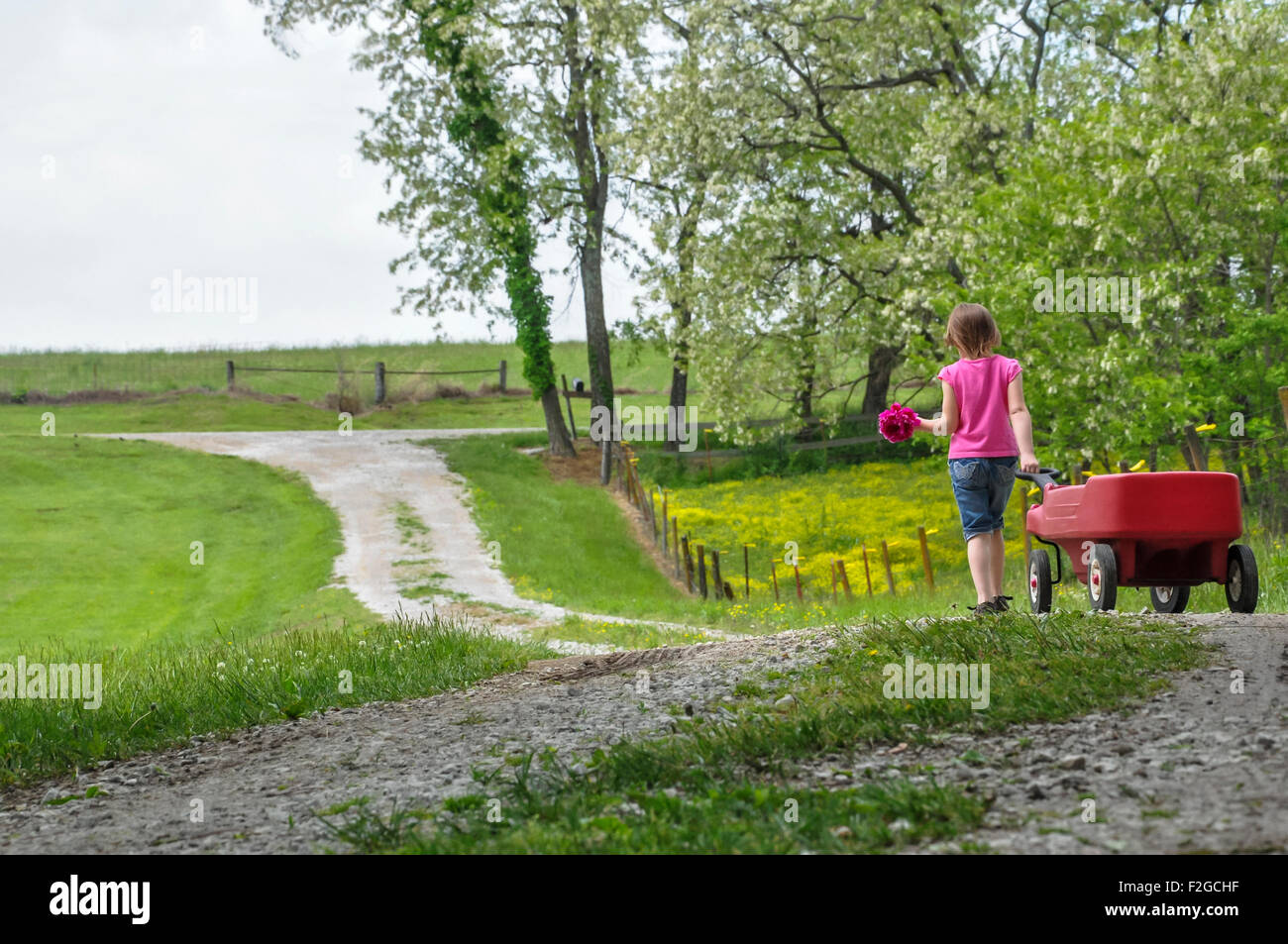 Girl walking Spring Lane Stock Photo - Alamy