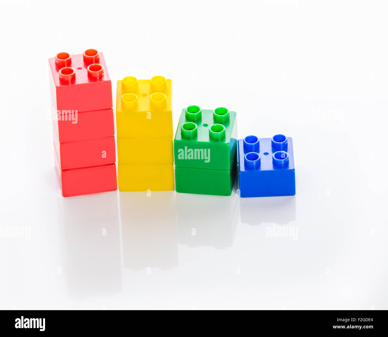 Colorful plastic building bricks on white background Stock Photo - Alamy