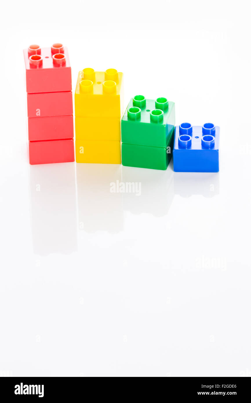 Colorful plastic building bricks on white background Stock Photo - Alamy