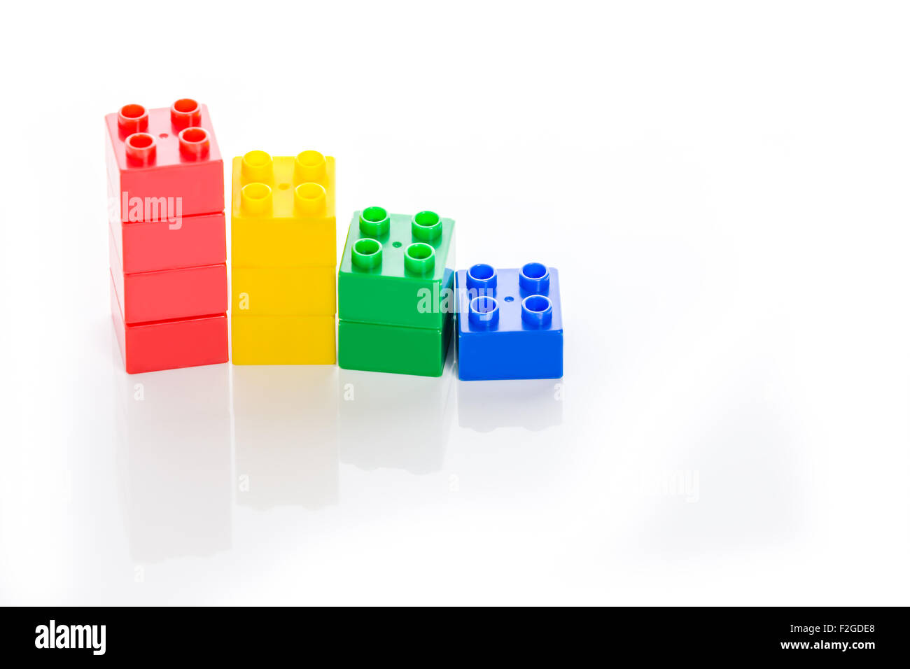Colorful plastic building bricks on white background Stock Photo - Alamy