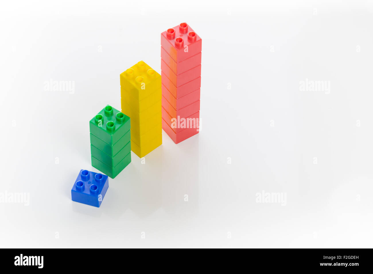 Colorful plastic building bricks on white background Stock Photo - Alamy