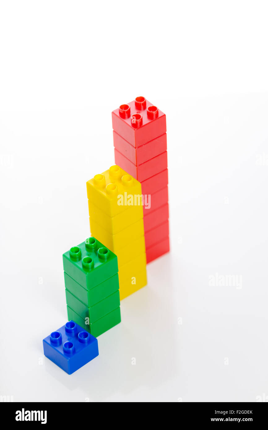 Colorful plastic building bricks on white background Stock Photo - Alamy