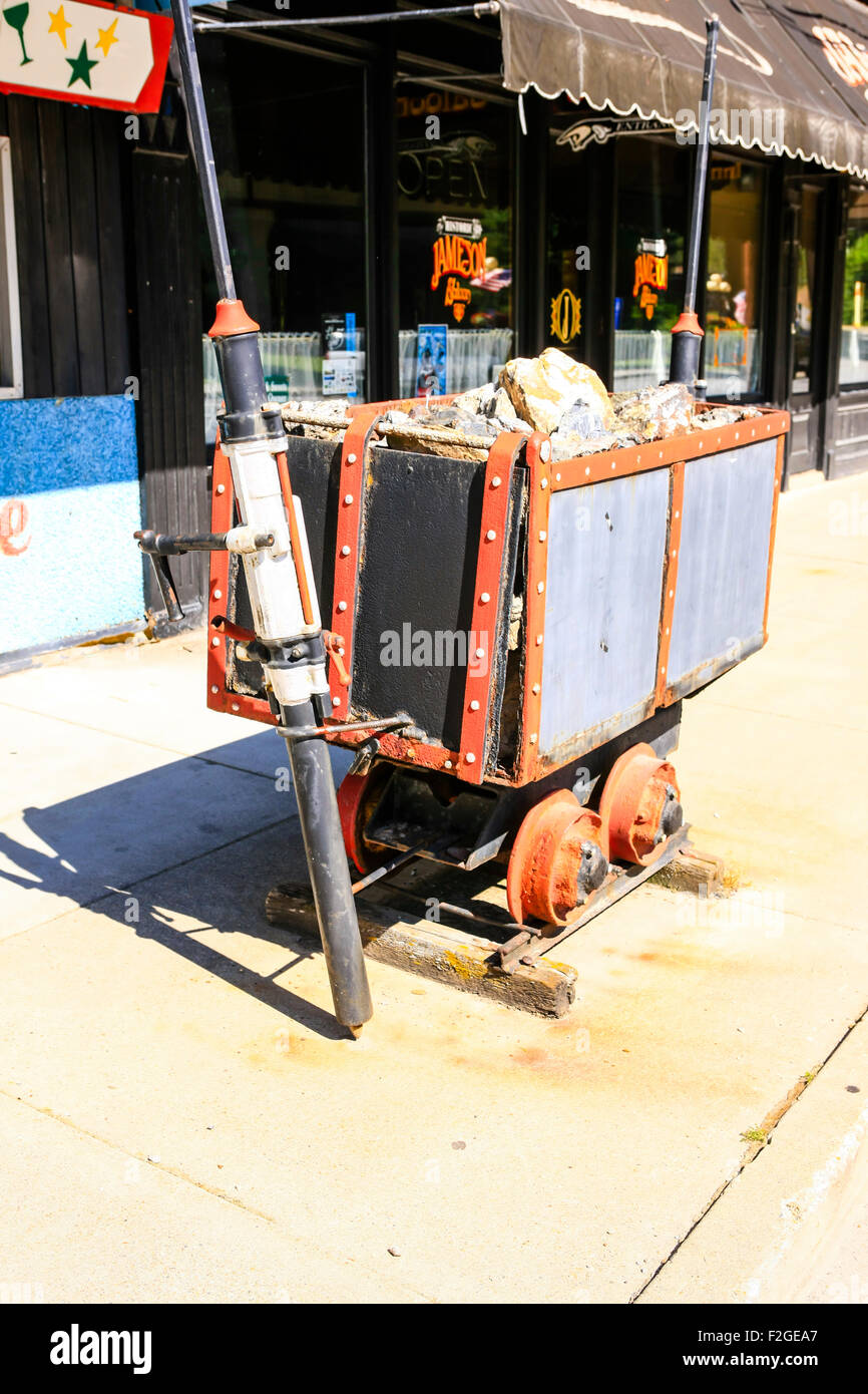 Old disused Silver mining trucks on the sidewalks of the historic city ...