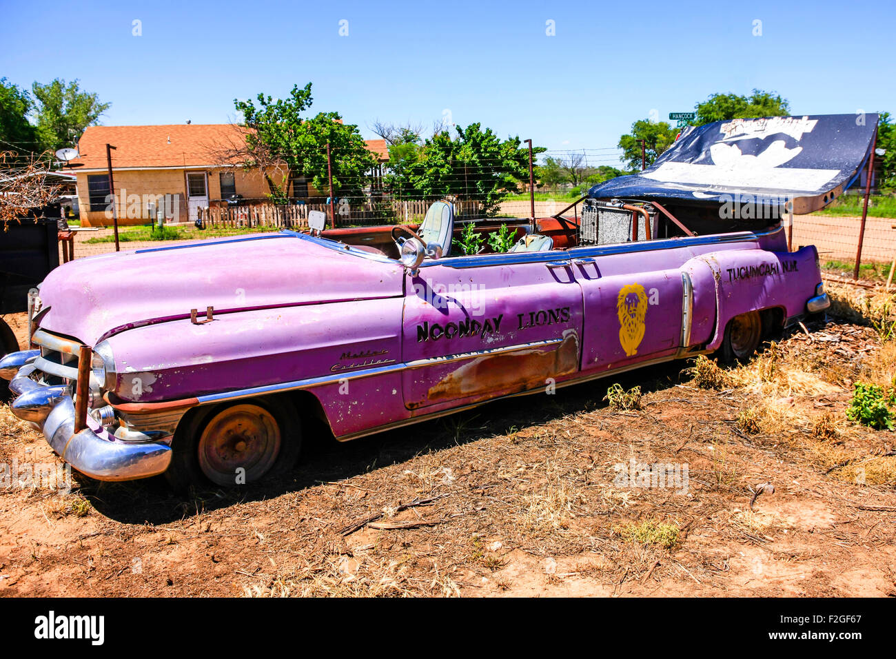 Old Purple painted abandoned Cadillac in a junkyard on Route 66 in ...