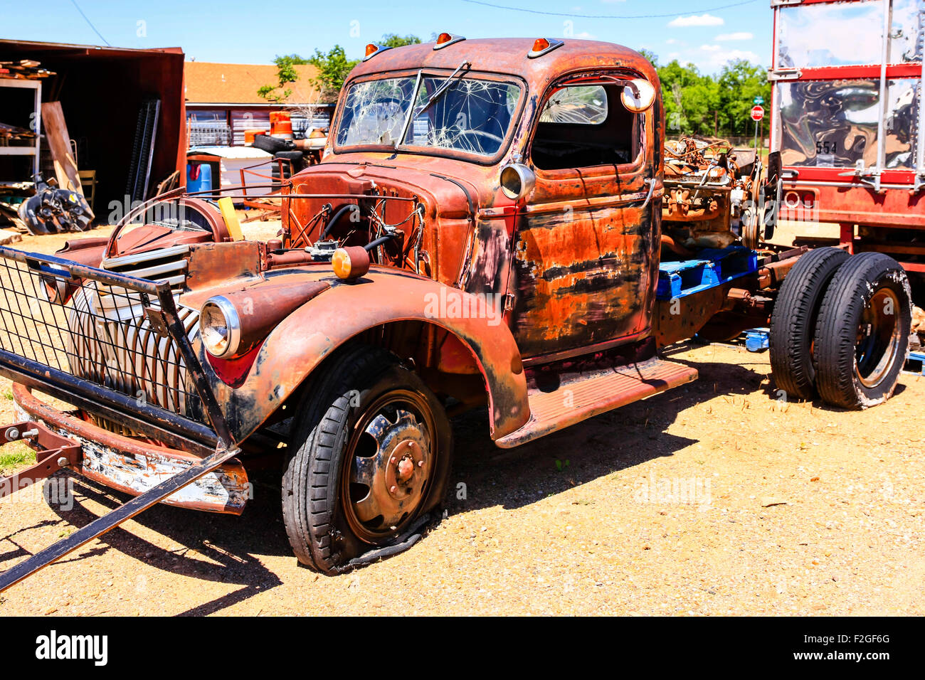 An un restored 1940s Ford flatbed truck in a collectors yard in ...