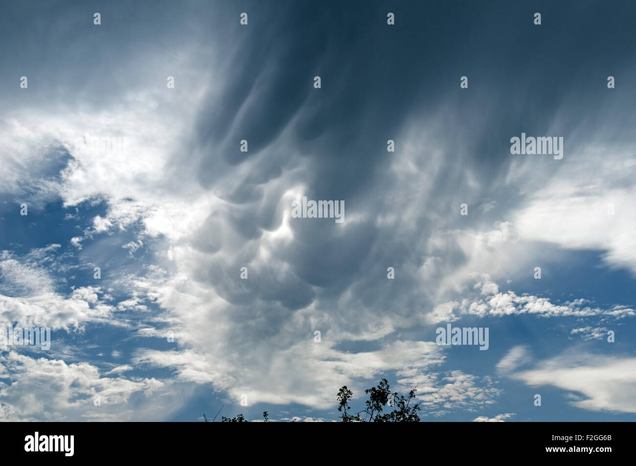 Strange cloud formation (possibly mammatus) after a light shower. At ...