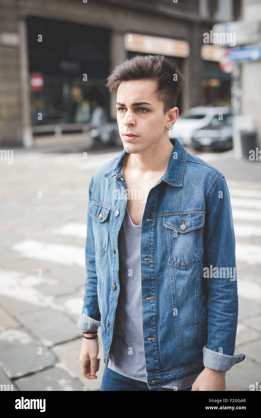 Knee figure of young handsome alternative dark model man posing in the ...