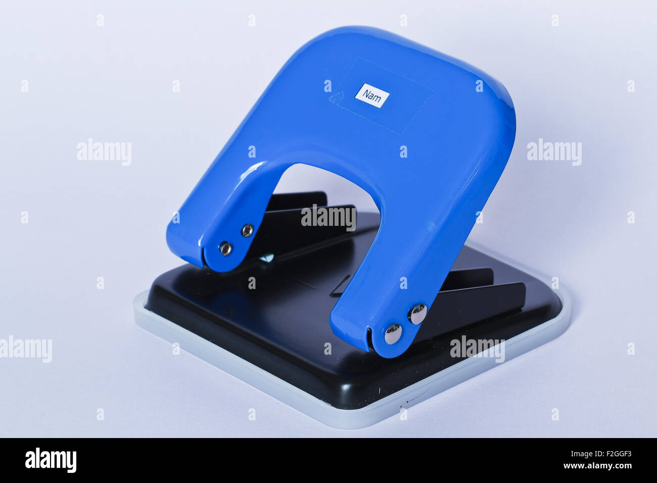 Blue Paper Puncher Stock Photo - Alamy