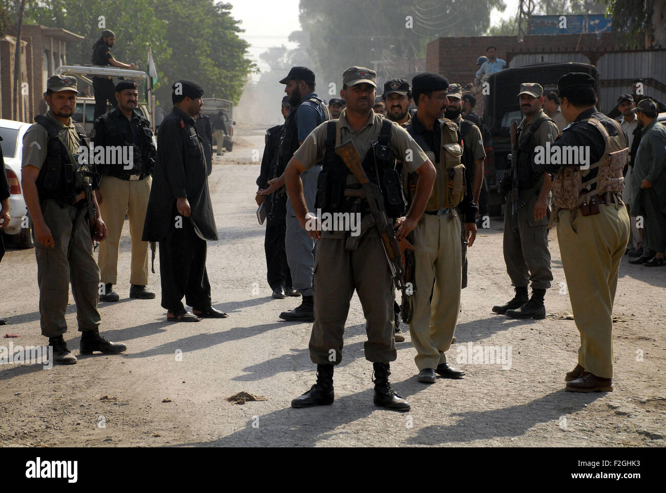 Peshawar. 18th Sep, 2015. Pakistani security personnel take position ...