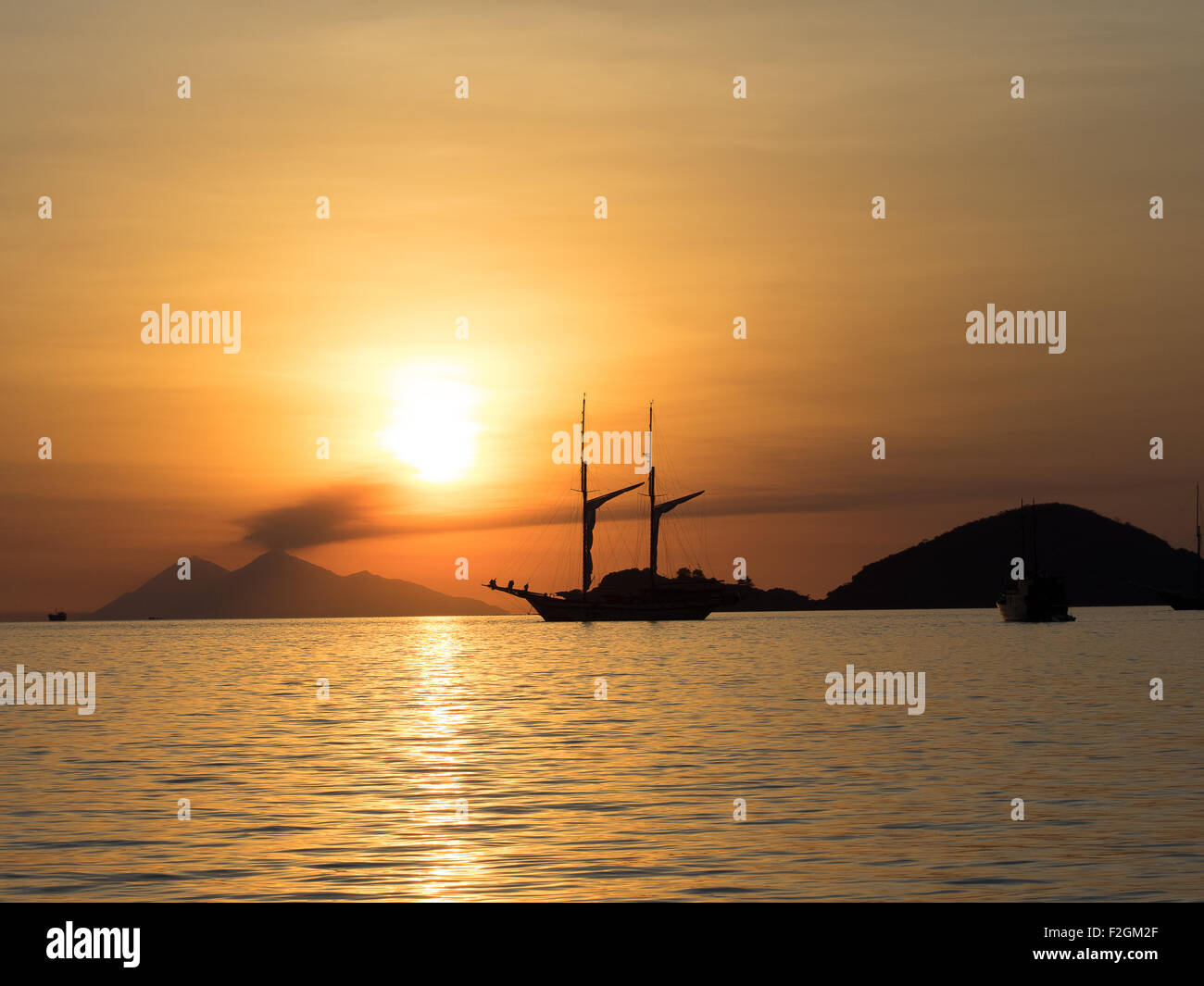 Sunset on flores island, bali, indonesia Stock Photo - Alamy