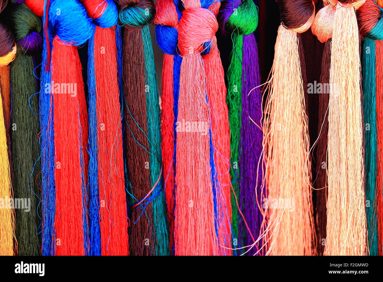 Set of manycolored threads for weaving hanging on the outside of a shop ...