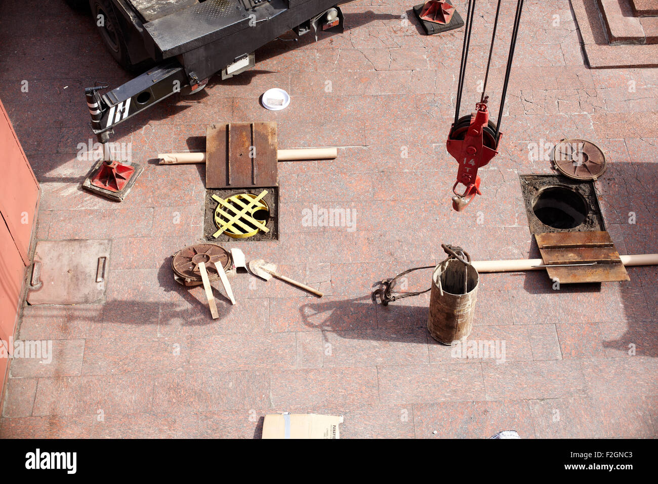 Tools next to the Manhole opened for maintenance Stock Photo - Alamy