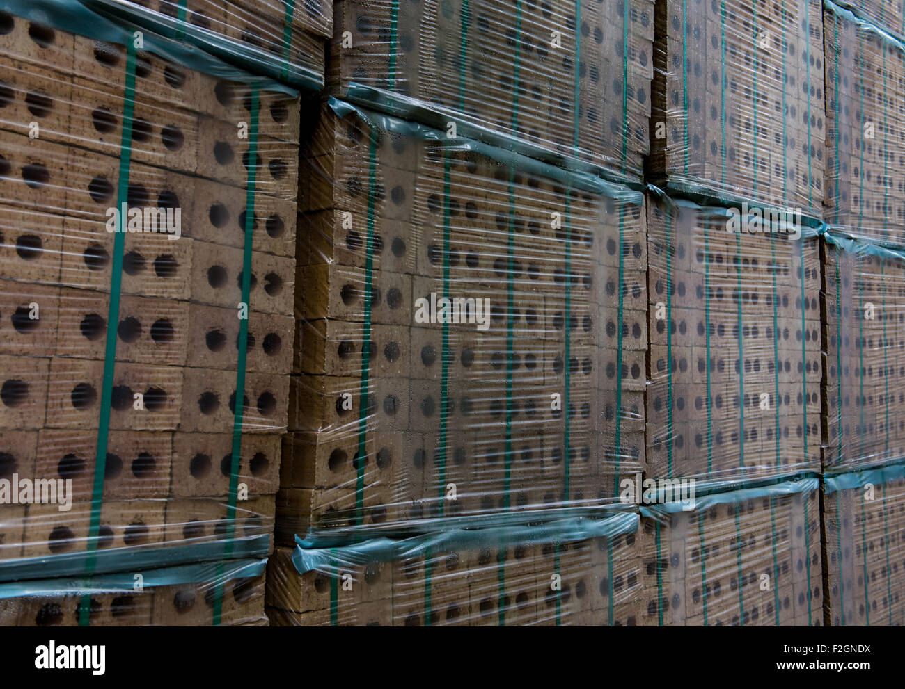 Stacks of packaged bricks Stock Photo - Alamy