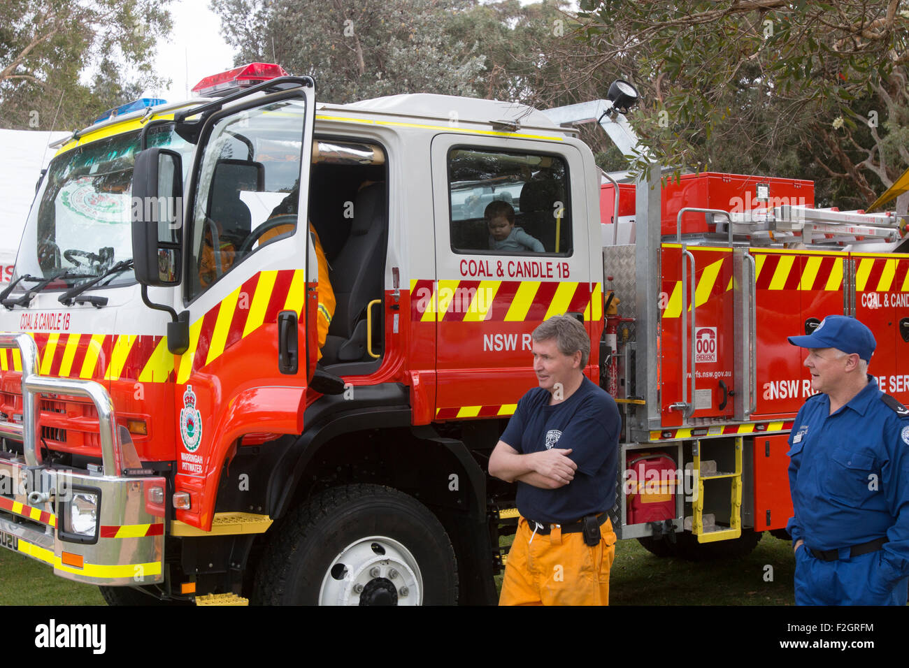 New south wales rural fire brigade service truck engine cab with young ...