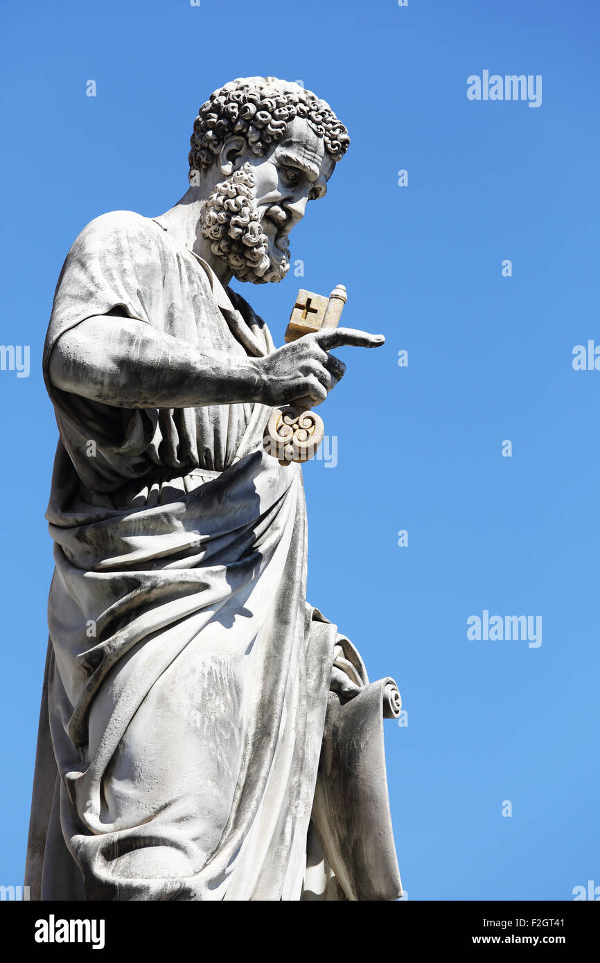 Statue of St. Peter holding a key in St. Peter's Square at the Vatican ...