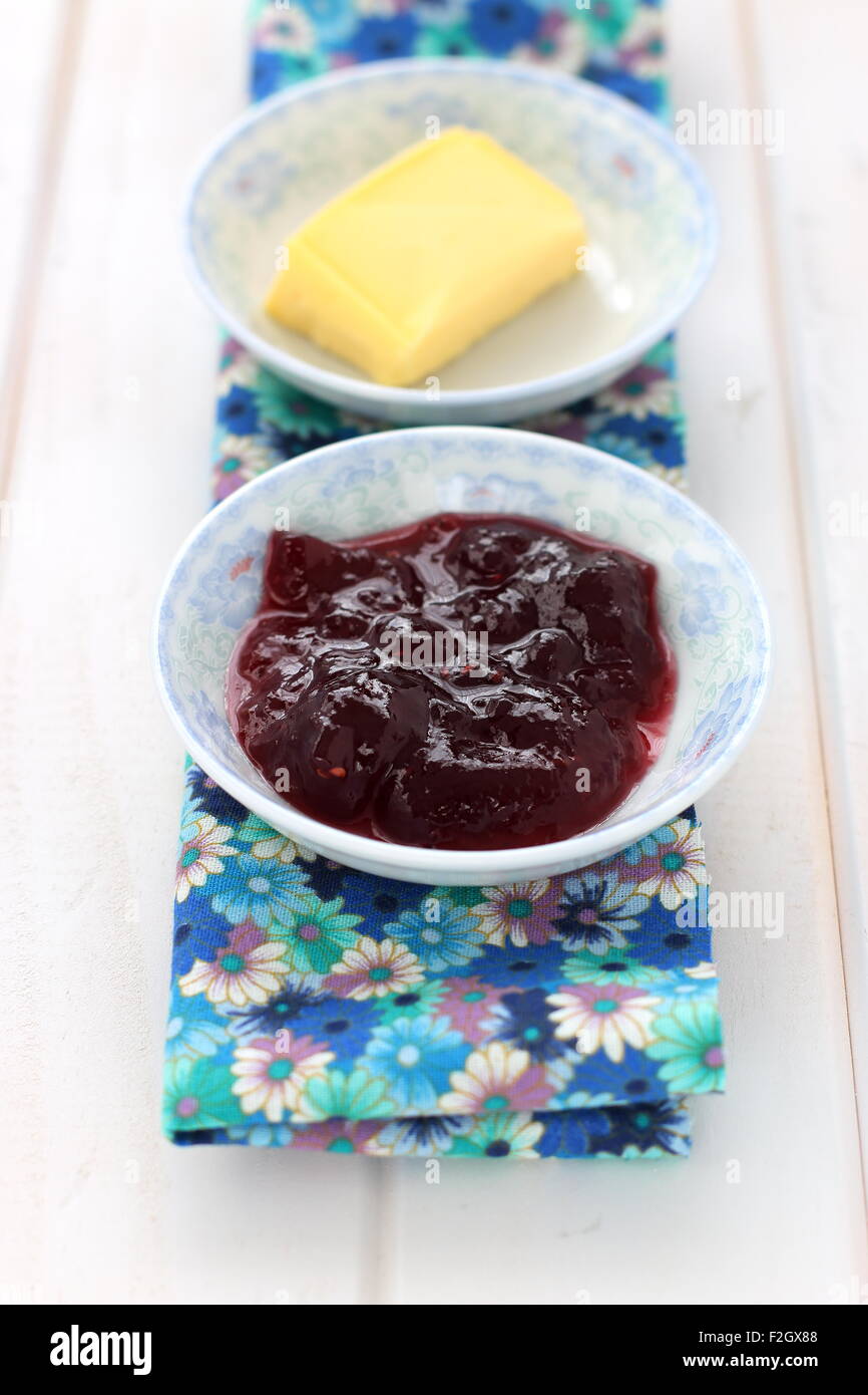 Jam and Butter on white timber board Stock Photo - Alamy
