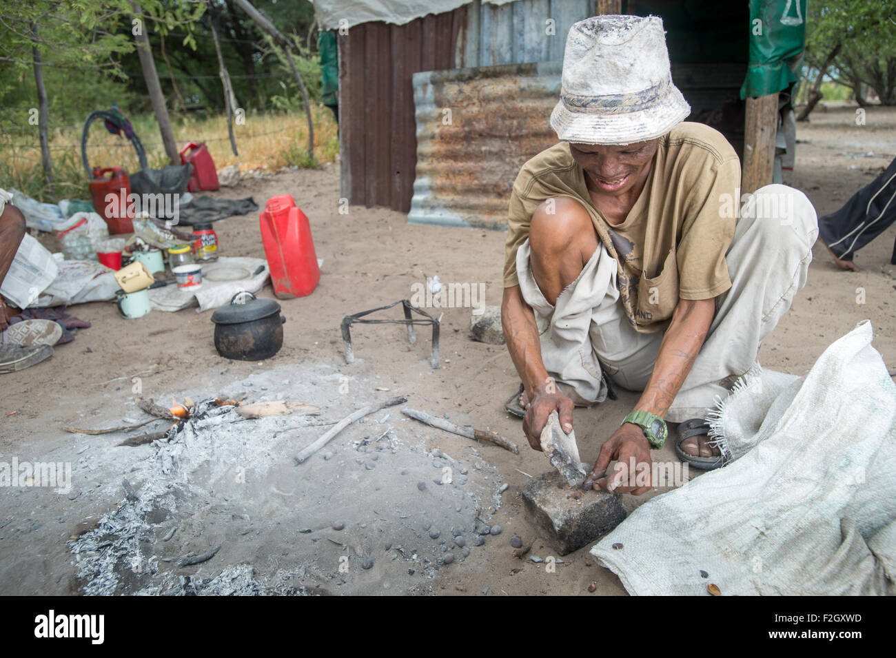Bushmen or San people preparing food in Botswana, Africa Stock Photo ...