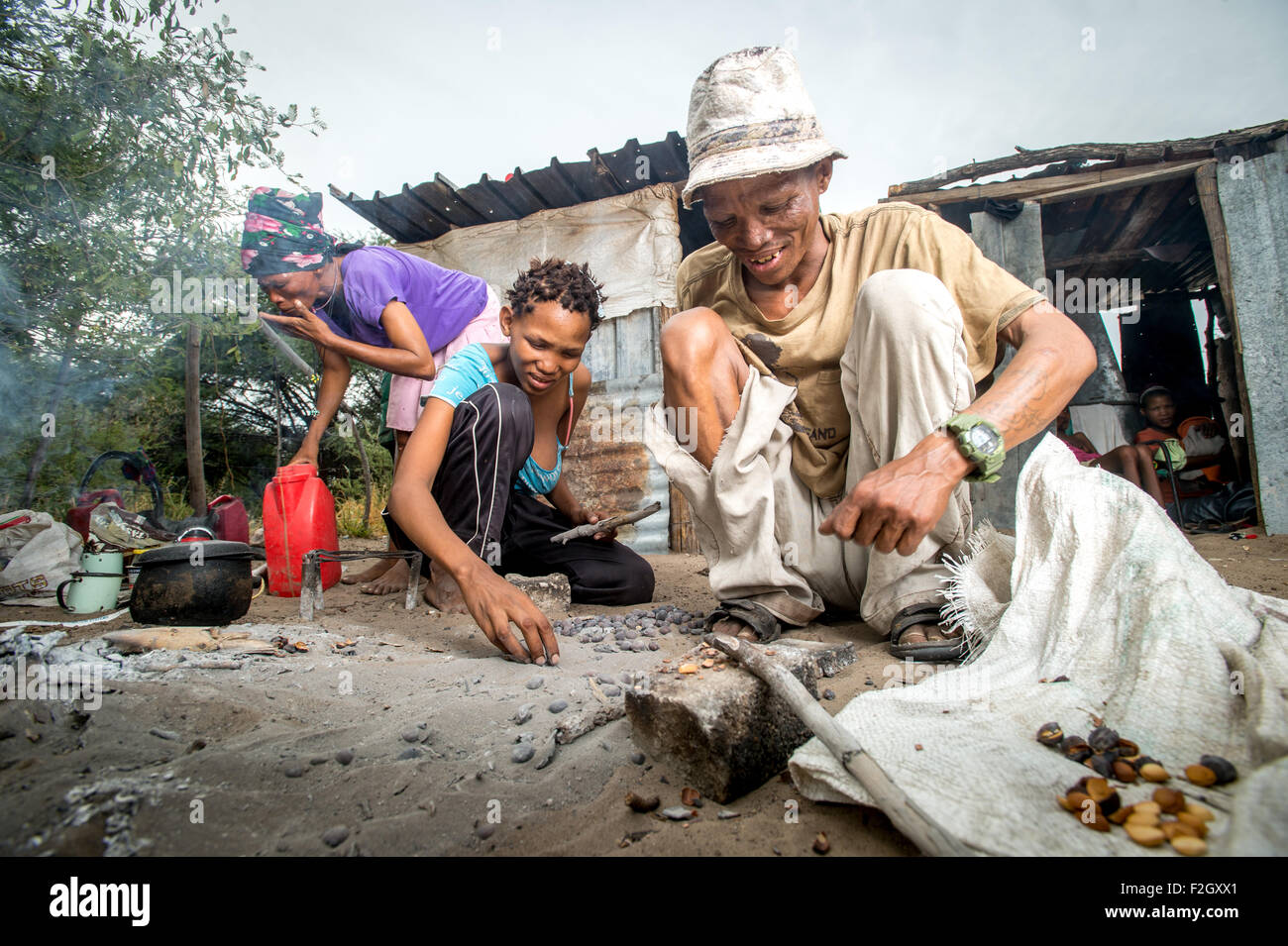 Bushmen or San people preparing food in Botswana, Africa Stock Photo ...
